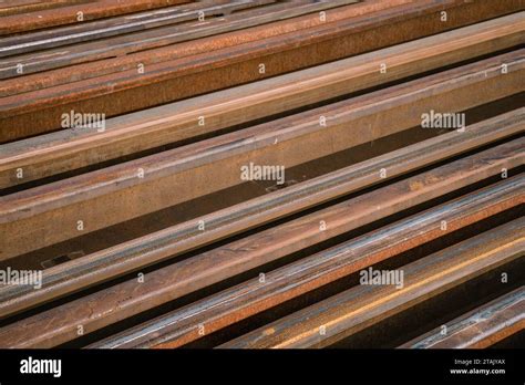 Many New Rails Of Different Length Stored At A Ground For Old Rails