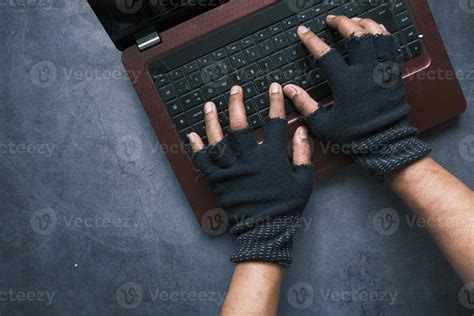 Hacker S Hand Stealing Data From Laptop Top Down View Stock Photo At Vecteezy