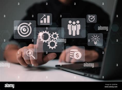 a businessman is working on a virtual innovation screen which is used for operations management