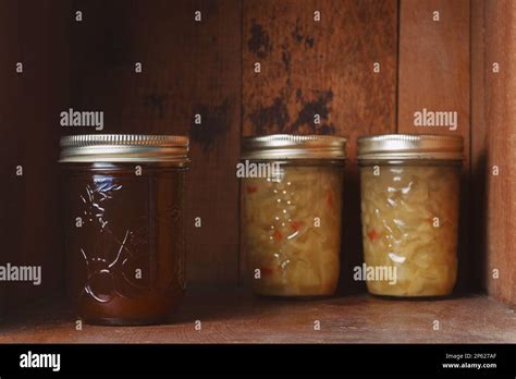Preserved Strawberry Jam And Relish In Mason Jars On Rustic Wood Shelf Stock Photo Alamy