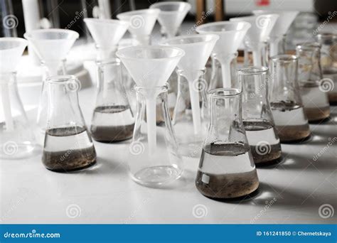 Laboratory Glassware With Soil Extracts And Funnels Stock Photo Image Of Empty Conical 161241850