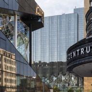 Faceted Glass Atrium Bisects Oma S Axel Springer Building In Berlin