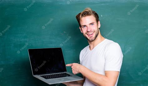 premium photo school teacher programming with laptop handsome man use