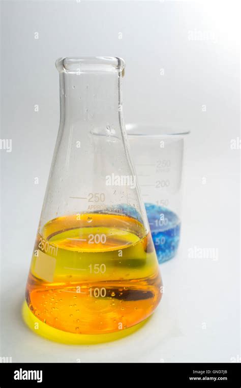 Close Up Glass Measuring Beaker For Science Experiment Background Stock