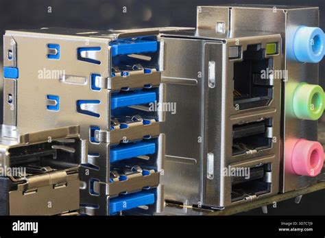 Close Up Of A Metal Back Panel Featuring Stacked Usb Ports Rj 45 And