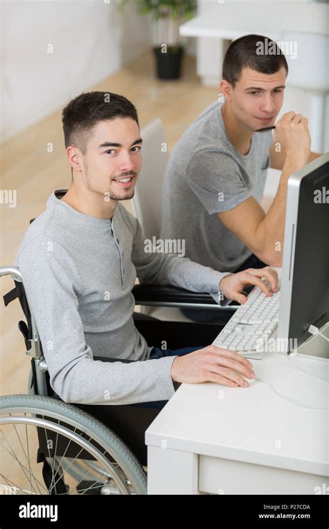 Student In Wheelchair Typing On Computer Stock Photo Alamy
