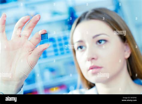 Technician Examining Microchip In Microelectronics Laboratory Stock Photo Alamy