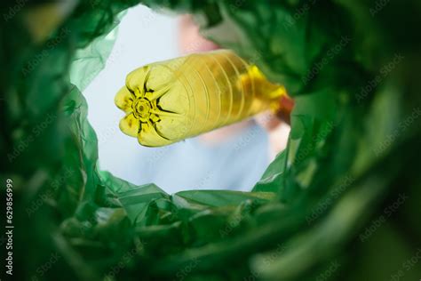 Low Angle View Unrecognizable Man Sorting Yellow Plastic Bottles