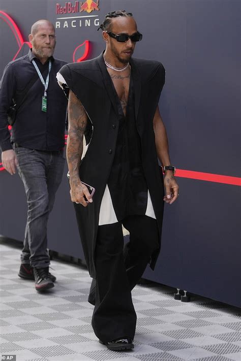 Lewis Hamilton Showcases His Quirky Fashion Sense As He Walks The