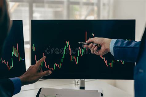 Stock Trader Looking At Stock Market Chart On Screen Analyzing