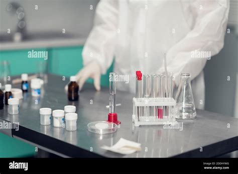 Scientists Hands On The Lab Table Chemical Laboratory In Action A Close Up Picture Of The