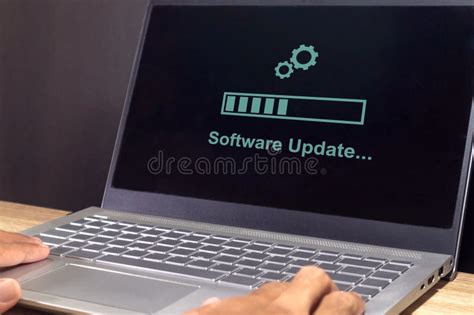 a laptop on the table with updating progress bar on screen software