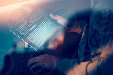 Hacker Using A Computer Smartphone And Coding To Steal Password And