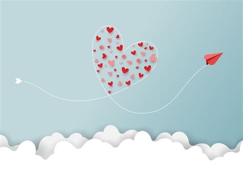 사랑 개념의 종이 예술 빨간 비행기 비행 프리미엄 벡터