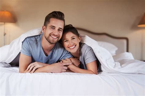 Love Couple Or Relax On Bed With Portrait Hug Or Happy For Travel In