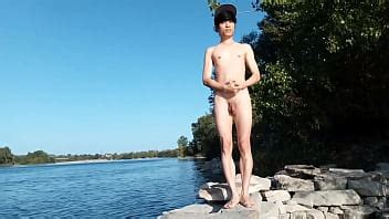 Naked Asian Boy Doing Yoga Outdoors Above Water While Passing Men In The Corner Look On XNXX
