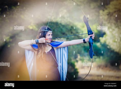 Elven Wood Princess Shooting Bow And Arrow Stock Photo Alamy
