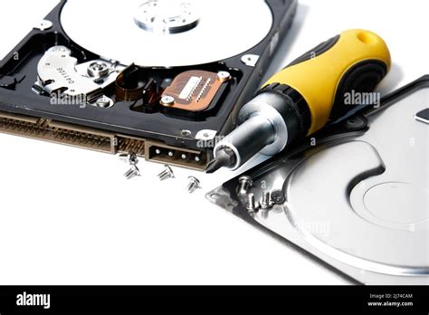 Open Hard Drive And Screwdriver Isolated On White Background Closeup Computer Hard Drive HDD