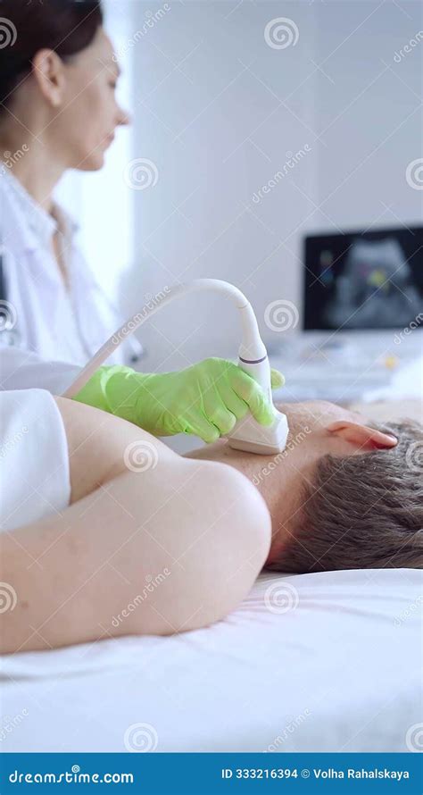 Doctor Woman With Green Medical Gloves Performing Neck Ultrasound Exam
