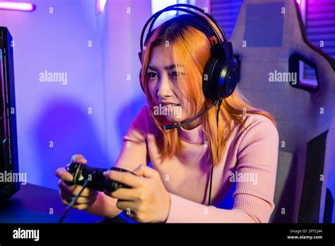 Woman Wear Gaming Headphones Playing Live Stream Esports Games Console At Home Gamer Using