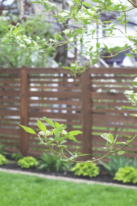 1 Year Later Horizontal Cedar Slatted Fence Transformation