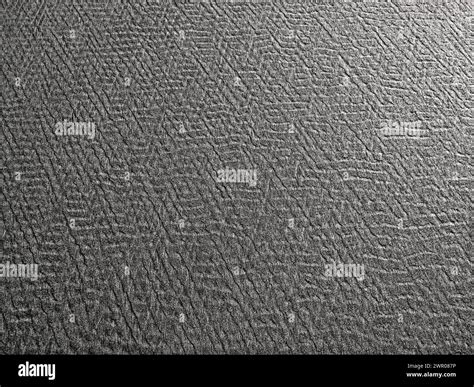 A Textured Surface Is Displayed Characterized By Its Detailed And