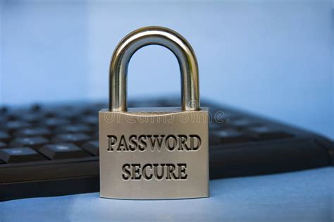 password secure text engraved on padlock with blurred keyboard