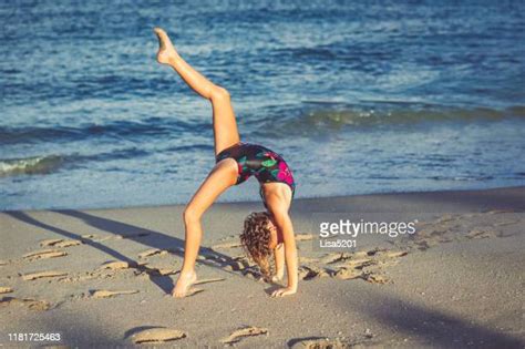 Girl Practices Gymnastics At The Beach High-Res Stock Photo - Getty Images