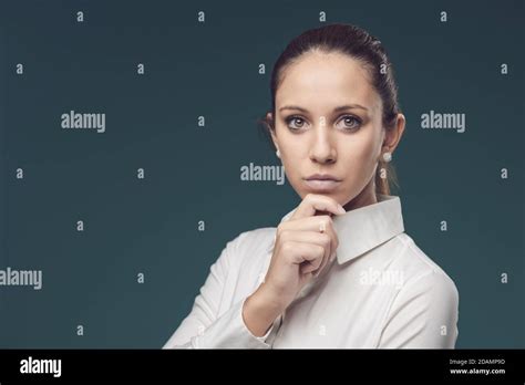 Pensive Young Woman Thinking With Hand On Chin Problem Solving Concept