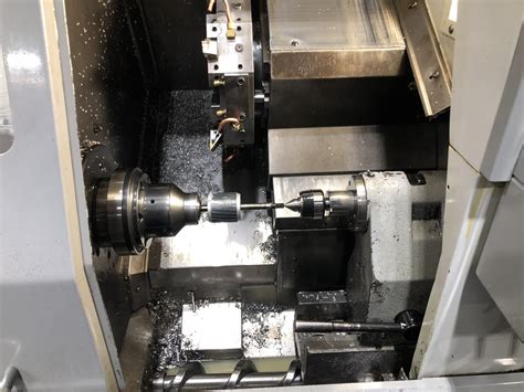 Haas SL CNC Lathe Tailstock C Collet Auger Revelation Machinery