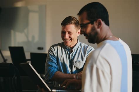 Premium Photo Portrait Of Two Professional Male Programmers Working