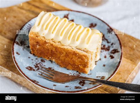 French Dessert Called Mille Feuille Or Napoleon Cake On Rustic Wooden
