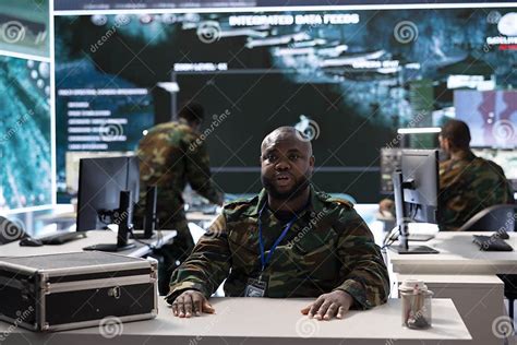 Army Personnel In A High Tech Command Center Attends A Videocall