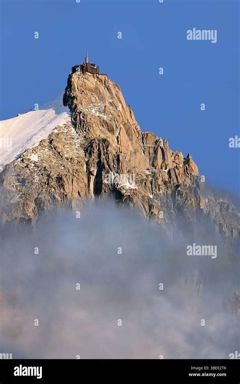Summit Of Aiguille Du Midi With Alpine Buildings Emerging From The Mist