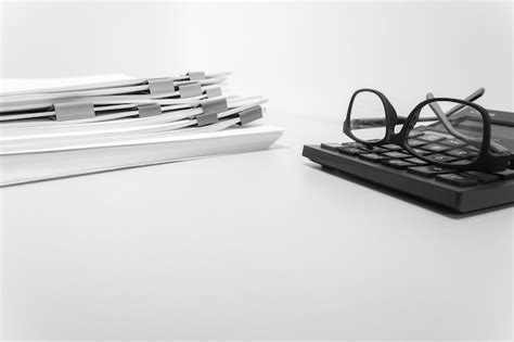 Premium Photo Calculator Folder With Documents And Glasses On The Desktop The Report Is