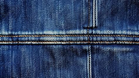 Textile Featuring Cotton Fabric Pocket And Rivet Accents On Denim Jeans