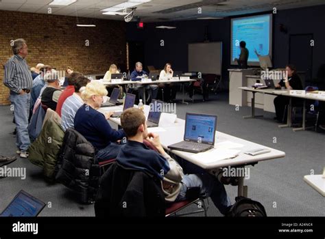 Adult Computer Class Training Is Conducted During A Business Meeting