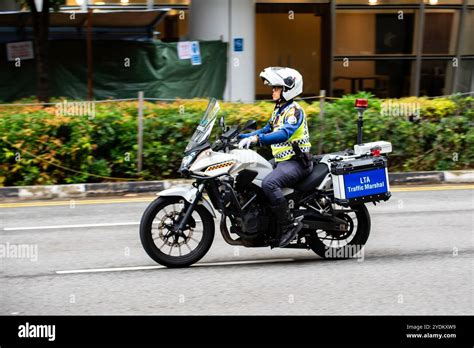 A Singapore Land Transport Authority Lta Traffic Marshall Riding A Motorbike In Central