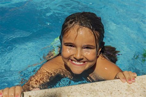Smiling Girl Getting Out Of The Water In The Pool Stock Image Image