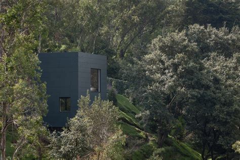 A Stacked Module House With A Perforated Facade
