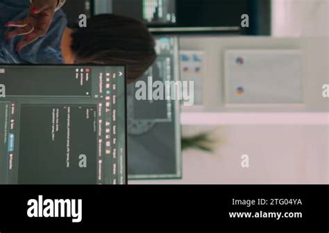 Vertical Video Software Engineers Analyzing Source Code And Database Brainstorming Ideas To
