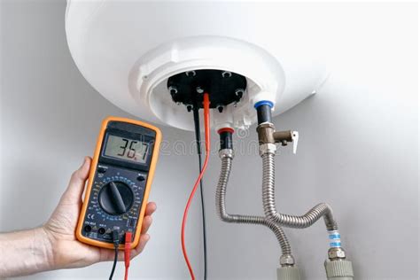 Men Using Multimeter To Test Heating Element Appliance Engineer Using