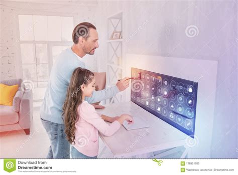 Attentive Programmer Checking The Numbers On The Screen While Working