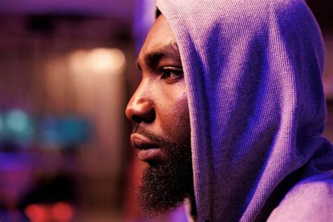 Premium Photo Concentrated African American Man In Hood Breaking Into Computer System In Dark