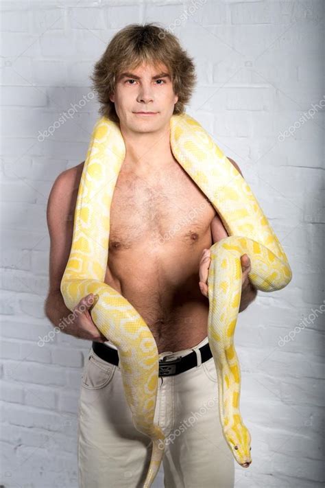 Man With Python Stock Photo OlgaOsa