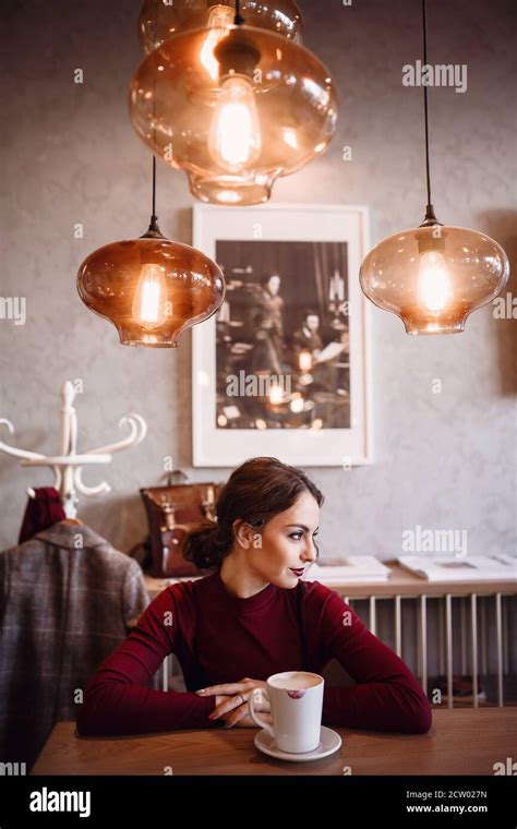 Portrait Of Woman Smiling In Coffee Shop Cafe Vintage Color Tone Young