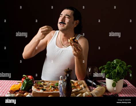 Stereotypical Italian Man Eating Pizza And Gesturing With Hand Stock