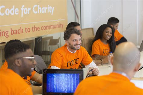 hackers coding for charity at hackathon stock image f022 3040
