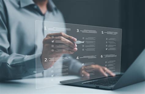 Premium Photo Businessman Evaluating Questionnaire On Laptop Computer