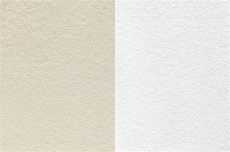 공예 베이지색과 흰색 종이 배경의 질감 반 2색 매크로 크림 공예 판지의 구조 프리미엄 사진